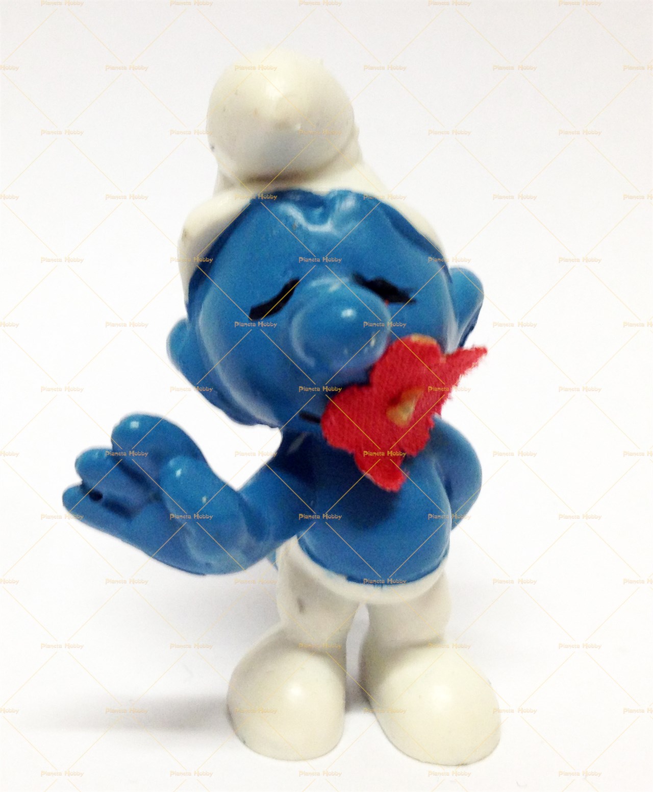 Puffo con fiore in bocca